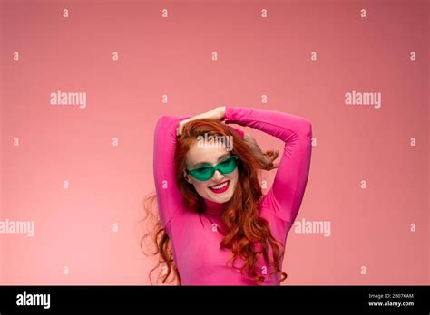 Portrait Of Smiling Redhead Girl Perfect Skin Beautiful Female Model With Long Hair Over Pink