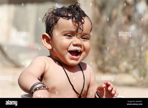 Portrait Of Smiling Face Adorable Baby Boy With Funny Expression And