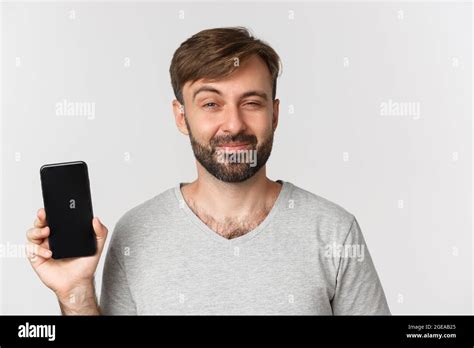 Close Up Of Pleased Smiling Man With Beard Looking Delighted And