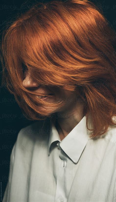 Portrait Of Ginger Female Whit Hair Covering Face By Stocksy Contributor Audshule Stocksy