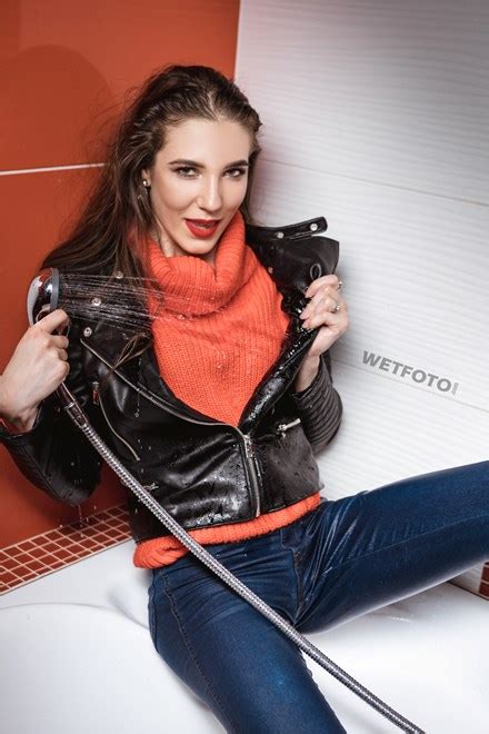 Wetlook Model In Warm Sweater And Jeans Gets Completely Wet In Bath Wetlookone