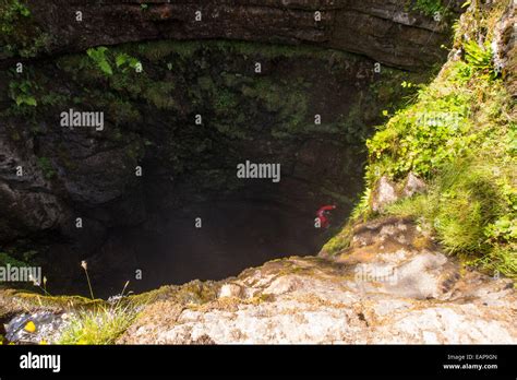 A Caver Descends The Famous Gaping Gill Cave On Ingleborough In The