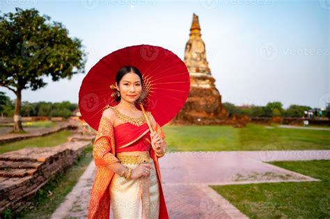 Beautiful Thai Girl In Traditional Dress Costume Red Umbrella As Thai Temple Where Is The Public