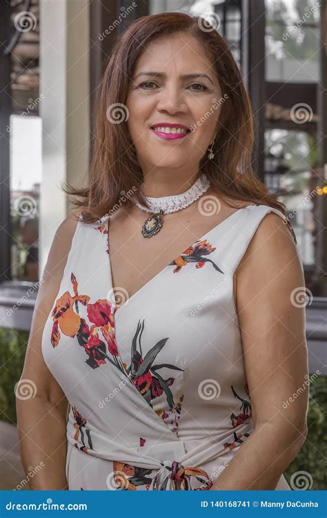 A Confident Hispanic Mature Woman Poses For A Photo Op Stock Image Image Of Camera American