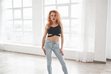 Standing Straight Attractive Redhead Woman Posing In The Spacey Room Near The Window 8681582