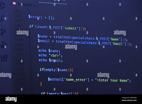 the software developer is doing php coding abstract code background selective focus code on