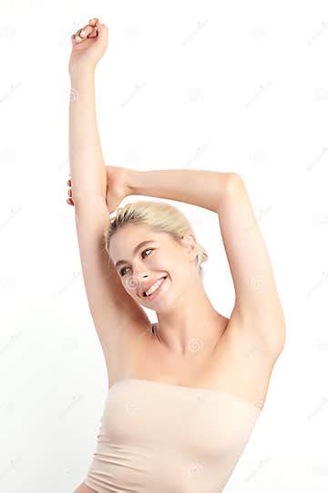Beautiful Young Woman Lifting Hands Up To Show Off Clean And Hygienic Armpits Or Underarms On