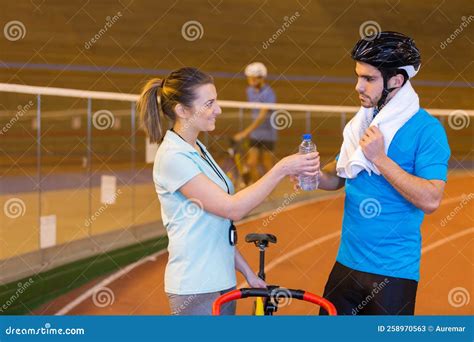 Coach Passing Bottle Water To Cyclist In Velodrome Stock Image Image Of Cyclist Young 258970563