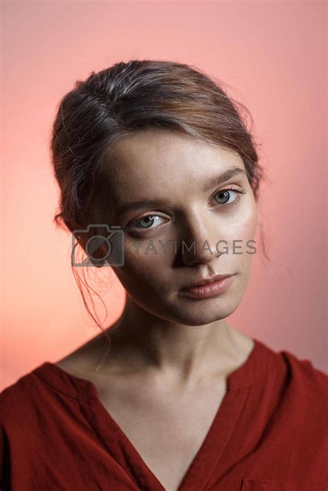 Pretty Sensual Caucasian Girl In Red Shirt Looking Into Camera And Tilting Her Head Beauty