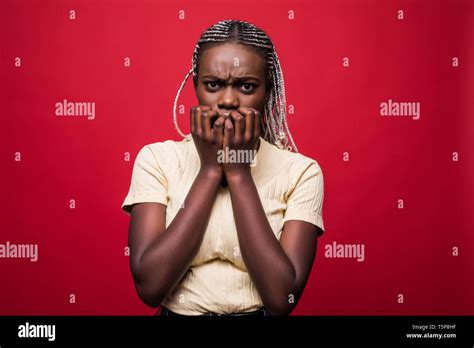Headshot Of Beautiful Scared Young Dark Skinned European Woman Closing Mouth Not To Scream