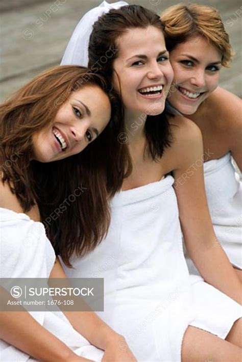 Three Women Wearing Towels And Smiling Superstock