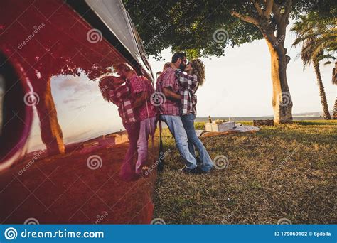 romantic adult of caucasian couple kiss and hug together in outdoor leisure activity picnic in
