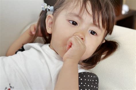 Lying Japanese Girl With Sucking Her Finger Stock Image Image Of Snoozing Person 96543649
