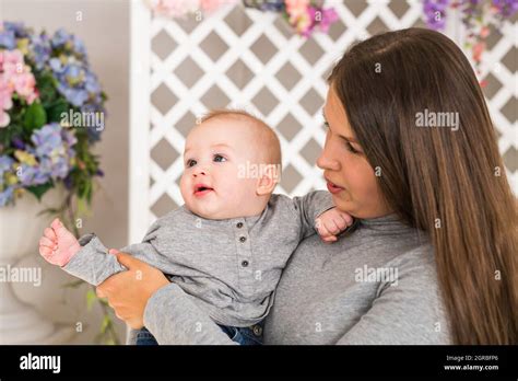 Portrait Of Mother Holding Baby Stock Photo Alamy