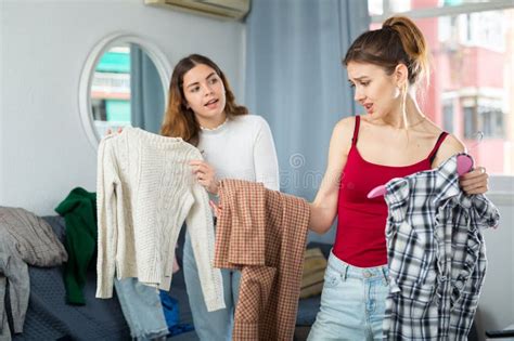 Two Girls Friends Sitting On Bench In Summer Park Chatting Happily Having Fun Stock Image