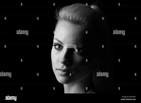 Portrait Of Beautiful Blonde Woman In Darkness With Soft Light On Her Face Pensive Silhuette In