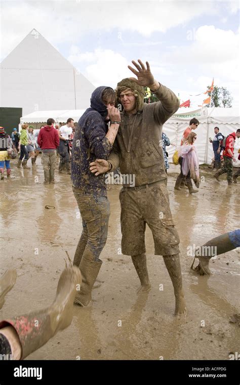 Two Happy Guys Covered In Mud At The Glastonbury Festival 2007 Stock