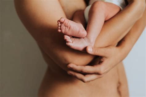 Premium Photo Naked Mother Holding Her Infant Baby