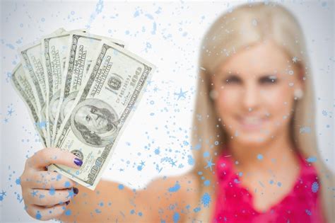 Premium Photo Beautiful Blonde Holding 100 Dollars Banknotes Against Snow Falling