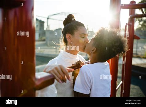 Mother Kissing Son Playground Hi Res Stock Photography And Images Alamy