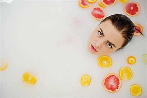 Free Photo Sexy Brunette Girl At The Bathroom With Milk And Fruits Youth Bath For Body