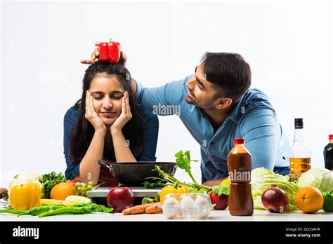 Indian Couple In Kitchen Young Beautiful Asian Wife Enjoying Cooking With Husband With Lots Of
