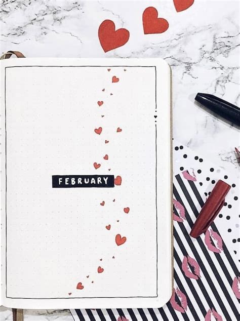 An Open Notebook With The Word February Written On It