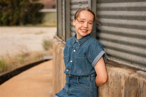 Image Of Portrait Of Happy Pre Teen Girl In Rustic Country Setting Austockphoto