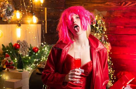 Crazy Drunk Girl In A New Years Dress And Pink Wig Showing Her Tongue At Camera Christmas