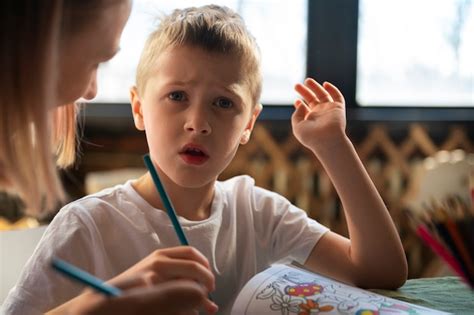 Free Photo Mother Educating Her Autistic Son At Home