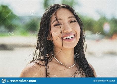 Sland Girl Beautiful Natural Asian Woman With Wet Hair And Big Toothy Smile Looking At The