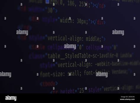 computer script typing work programmer typing new lines of html code closeup of java script