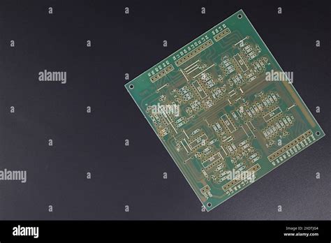 Green Electronic Circuit Board With Semiconductors On Black Background