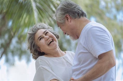 Asian Senior Happy Retired Couple Relax Smiling Elder Man And Woman Enjoying With Retired
